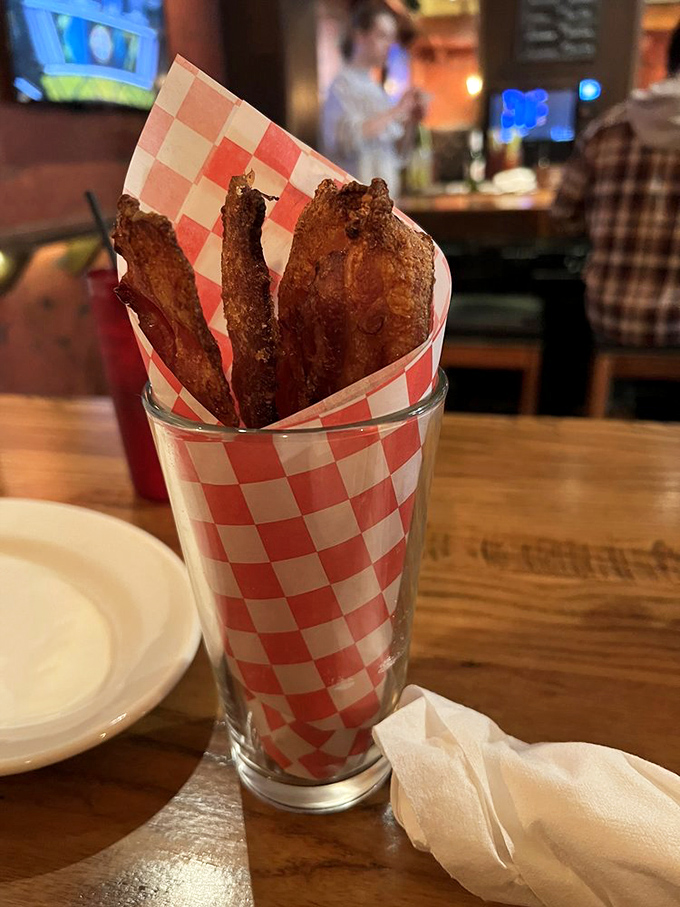 Brown sugar bacon that's basically meat candy. The kind of appetizer that makes the table fall silent except for the occasional "Oh my god."