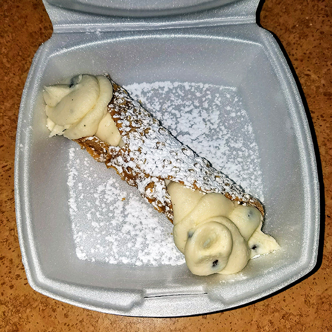 The cannoli&mdash;crisp shell, creamy filling, and a dusting of powdered sugar. Dessert perfection that makes you want to speak with your hands.