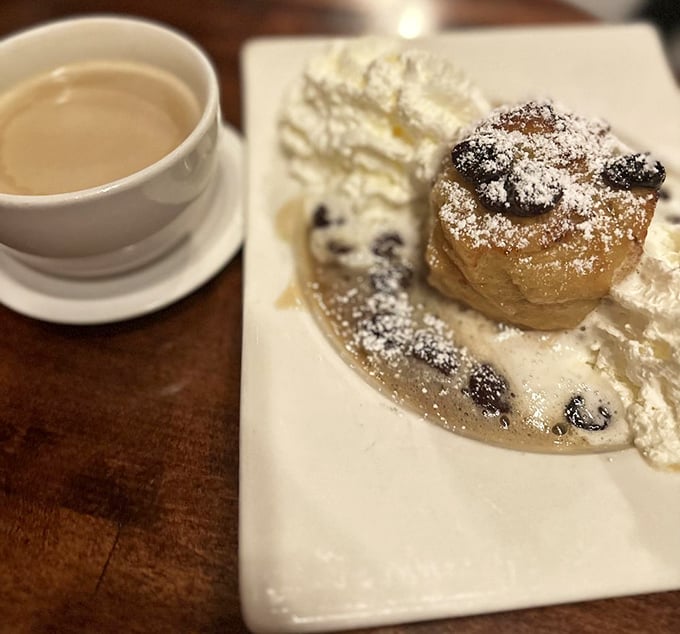 Caramel brioche bread pudding that's basically a warm hug in dessert form, complete with artistic sauce drizzles.