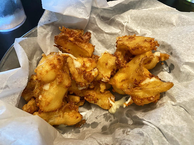 Cheese curds that look like they're wearing little golden jackets. In Minnesota, this counts as formal attire for your taste buds.