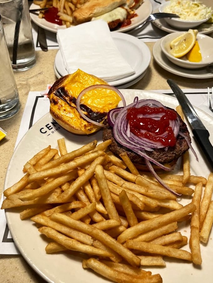 A burger that understands the importance of proper architecture: sturdy bun foundation, substantial beef, and toppings arranged for maximum flavor in every bite.