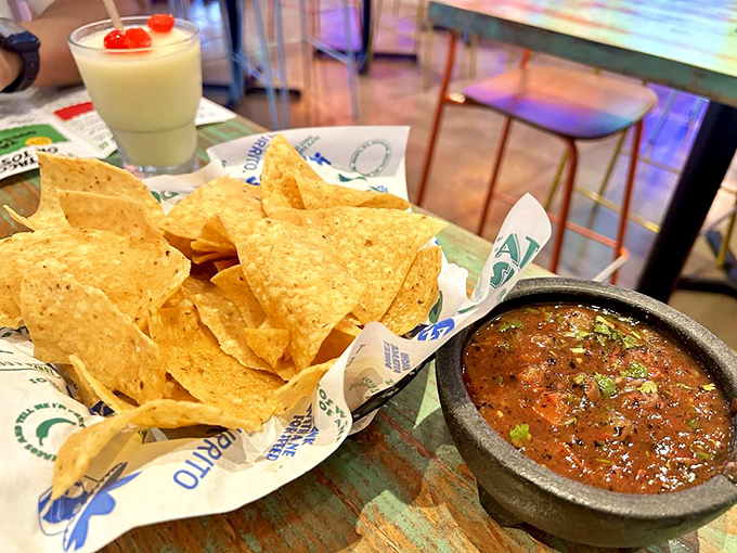 Chips so fresh they practically snap with pride next to salsa that's clearly not from a jar. Simple perfection.