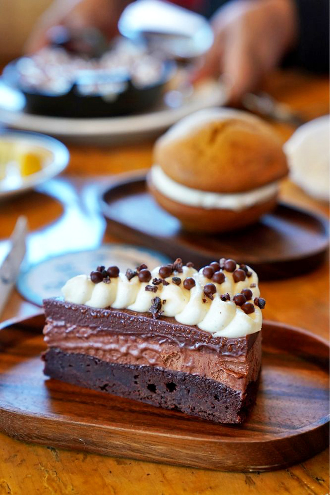This chocolate dessert doesn't just satisfy your sweet tooth—it files adoption papers with it. Those chocolate pearls on top are the crown jewels of an already royal treat.