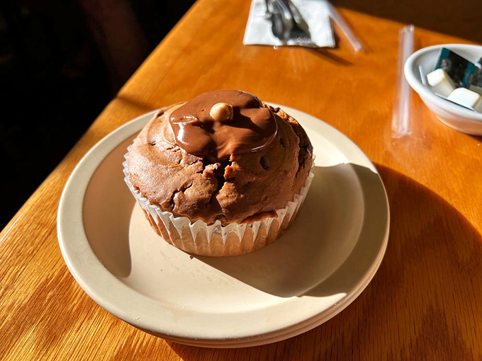 This chocolate peanut butter muffin isn't just breakfast &ndash; it's dessert with an alibi, sitting proudly on its plate like it knows exactly what it's doing.
