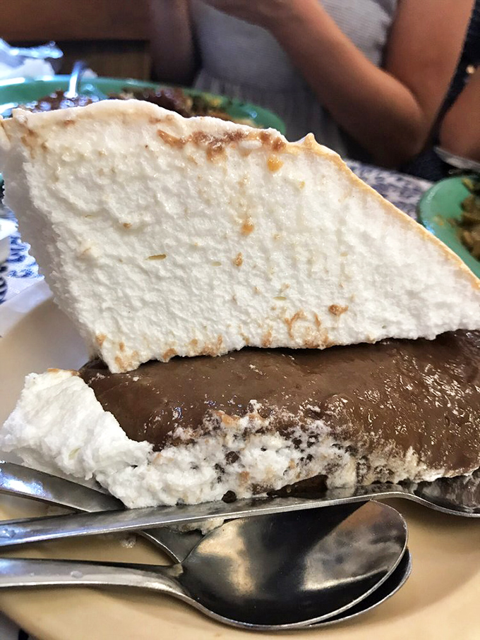 A slice of chocolate cream pie with a mile-high meringue that defies both gravity and restraint&mdash;one bite and you'll understand why locals save room.