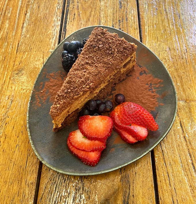 Layers of chocolate and dulce de leche create a dessert that's worth every calorie. The fresh berries are just pretending this is somehow healthy.