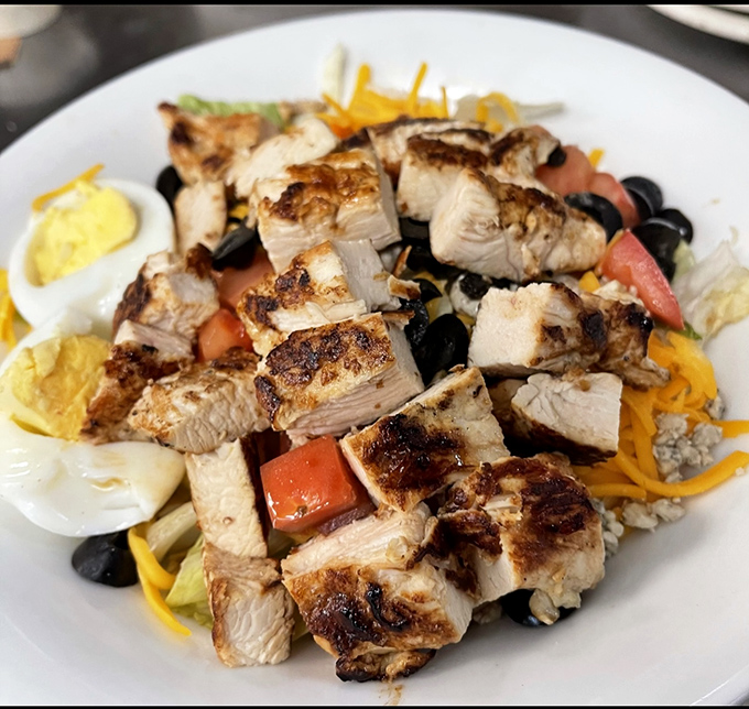 This chicken-topped salad isn't just a meal&mdash;it's a protein-packed landscape where perfectly grilled meat meets garden-fresh vegetables in delicious harmony.