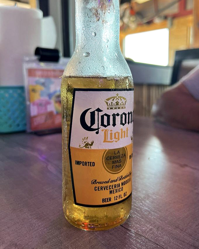 A frosty Corona, beaded with condensation, waiting patiently for its lime wedge. Some partnerships are just meant to be.