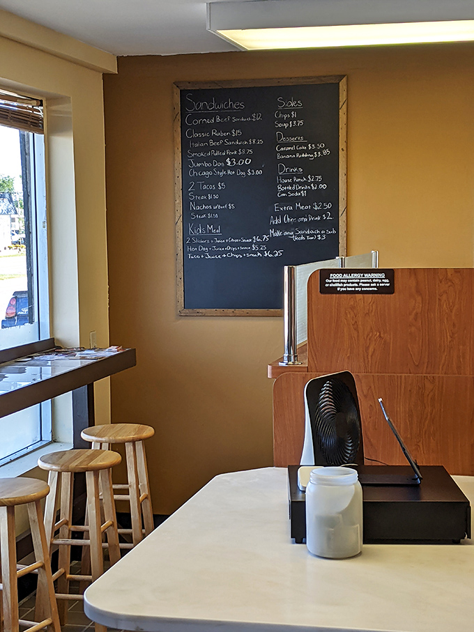 The heart of operations: a simple counter, a handwritten menu, and wooden stools where culinary memories are made daily.