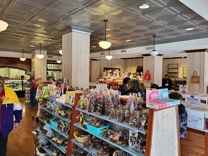 The store's beautiful interior showcases both architectural heritage and confectionery treasures under classic pendant lighting.