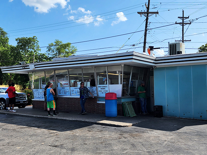 The universal language of waiting for great fried chicken transcends all demographics and brings communities together.