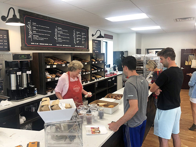 The line forms early at this Michigan gem, where friendly service and fresh donuts create a morning ritual worth waiting for.