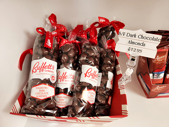 Sugar-free dark chocolate almonds nestled in festive baskets. The red ribbons aren't just decorative &ndash; they're holding back an avalanche of flavor.