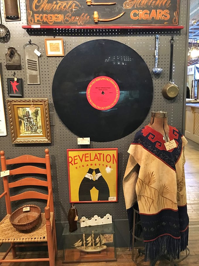 Vintage advertising meets Native American art in this eclectic display. That oversized vinyl record would make any music lover's wall sing.
