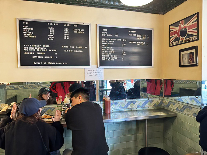 Where fish and chips bring strangers together. The cozy interior creates an intimate dining experience where conversations about proper chip-vinegar ratios naturally flow.