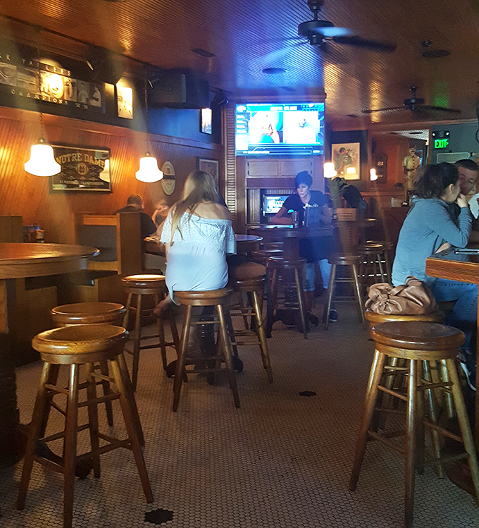 Where strangers become friends over shared tables and Notre Dame victories. The low lighting forgives all food-related fashion accidents.