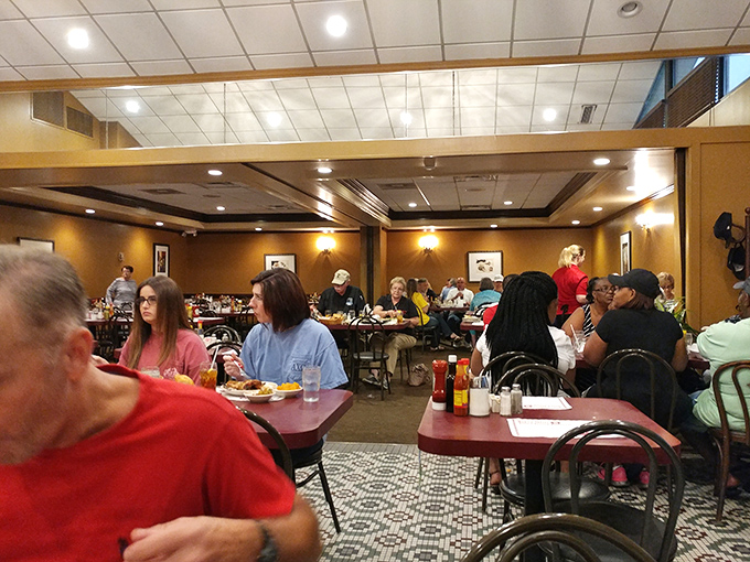 A diverse crowd fills every table, proving that Niki's West's appeal crosses all demographic lines&mdash;the universal language of delicious food spoken fluently here.