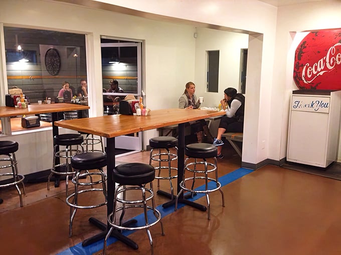 Fellow diners enjoying the simple pleasure of great food without pretense&mdash;the universal language of "mmm" needs no translation here.