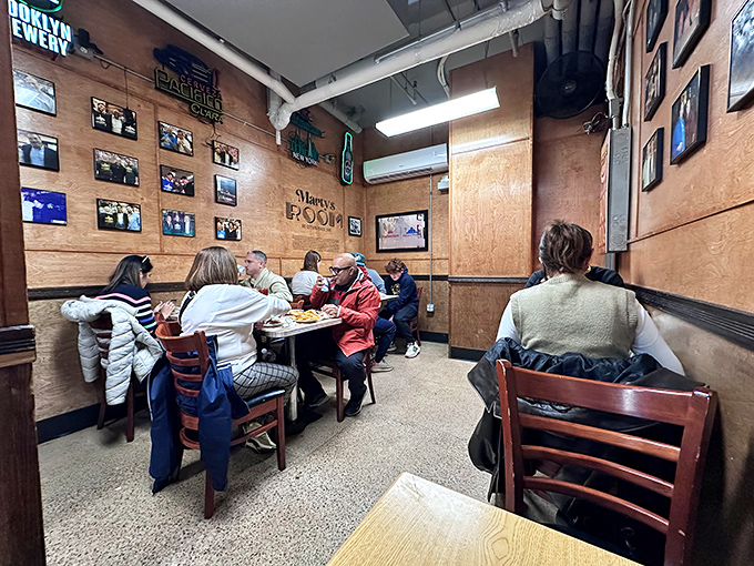 In this wood-paneled room, strangers become neighbors, sharing nothing but space and the universal language of "mmm" and "wow."