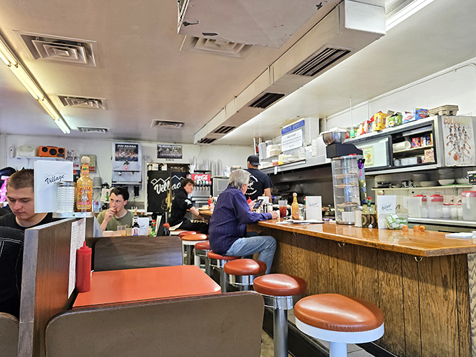 Morning philosophers gather at the altar of caffeine and carbs, solving the world's problems one pancake stack at a time.