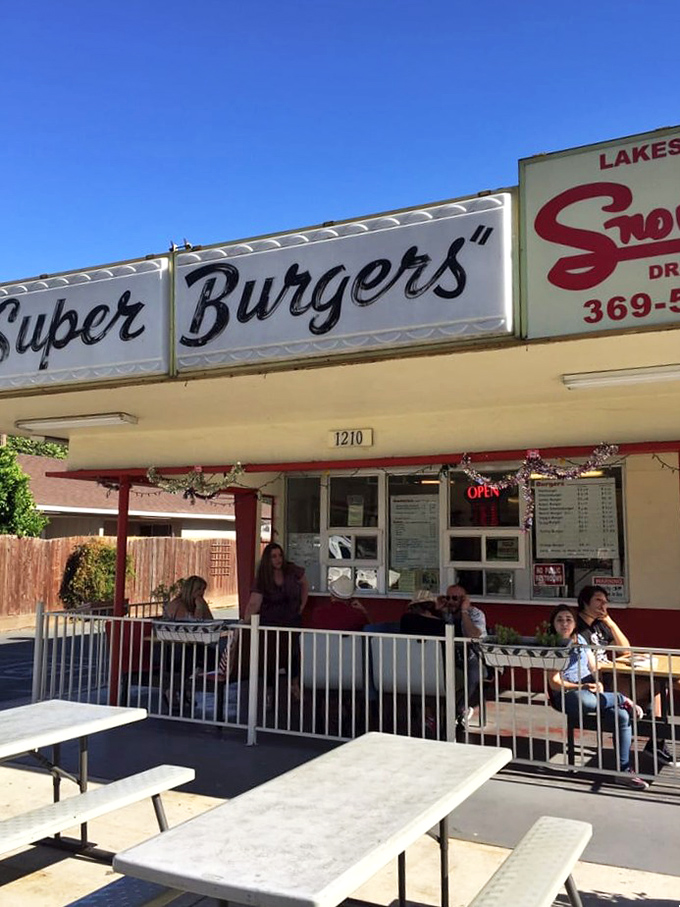 The outdoor seating area where strangers become friends, united by the universal language of "mmm, this is so good." 