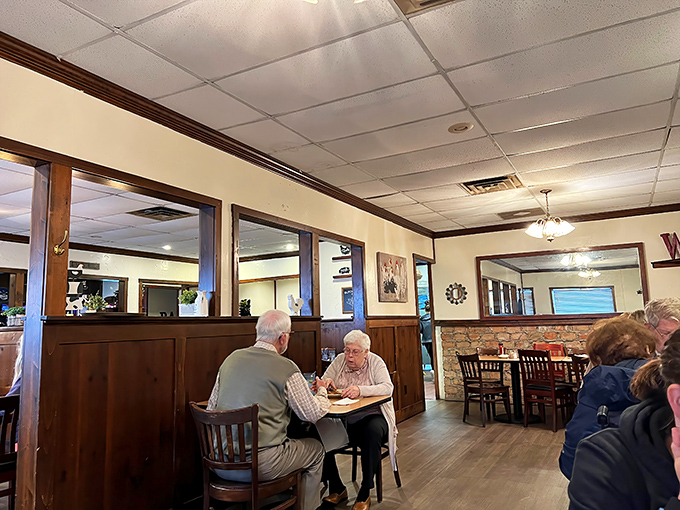 The dining room buzzes with conversation, proving that genuine connections happen best over plates of food that nobody's trying to photograph first.