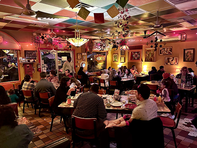 The dining room buzzes with the energy of happy eaters under a ceiling festooned with colorful decorations &ndash; proof that good food creates instant community.