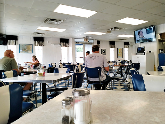 Morning regulars settle in for breakfast and conversation&mdash;the true rhythm of any great diner is the community that gathers within its walls.