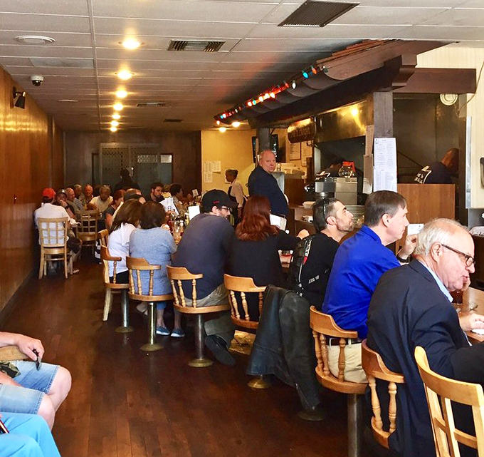 The counter ballet of diners hunched over plates, savoring bites between conversations&mdash;a scene unchanged since your parents' first date.