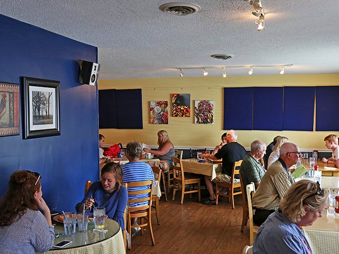 The bustling dining room hums with conversation and clinking silverware&mdash;breakfast's symphony playing out against blue and yellow walls.