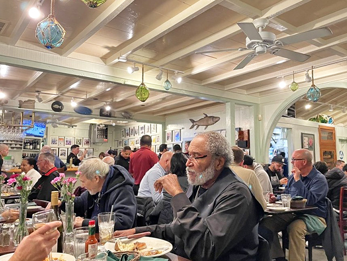 The dining room buzzes with the energy of people having religious experiences with seafood. That gentleman knows what I'm talking about.