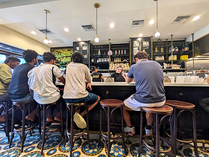 Locals know &ndash; grab a seat at the bar and watch culinary magic unfold while debating which sandwich to try next.