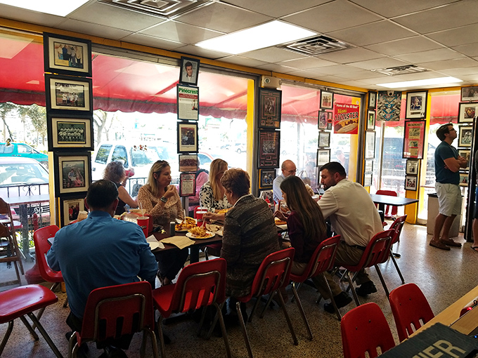 Strangers become temporary family around these tables, united by the universal language of "mmm" and "pass the napkins, please."