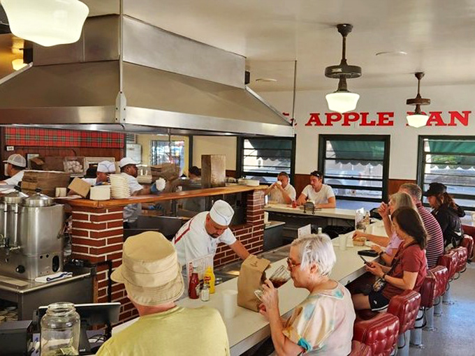 At The Apple Pan, generations of Angelenos have hunched over this counter, proving that good food creates a democracy where studio executives and construction workers sit elbow to elbow.