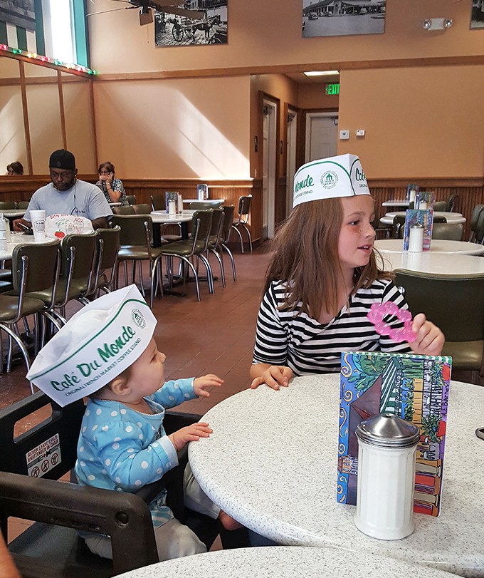 Cafe Du Monde creates multi-generational memories. Those paper hats will become treasured photos that embarrass these kids decades from now.