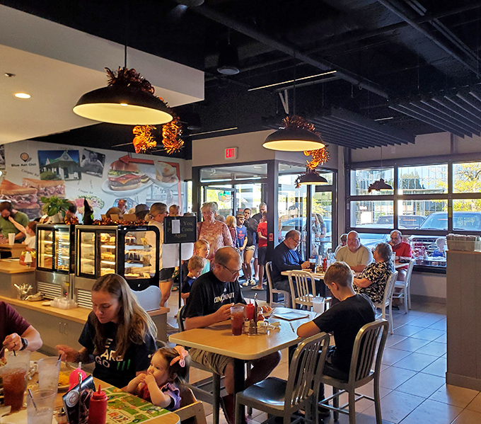 Families gather here not for the ambiance but for the food that creates memories. That "Please Wait To Be Seated" sign might as well say "Good Things Coming."