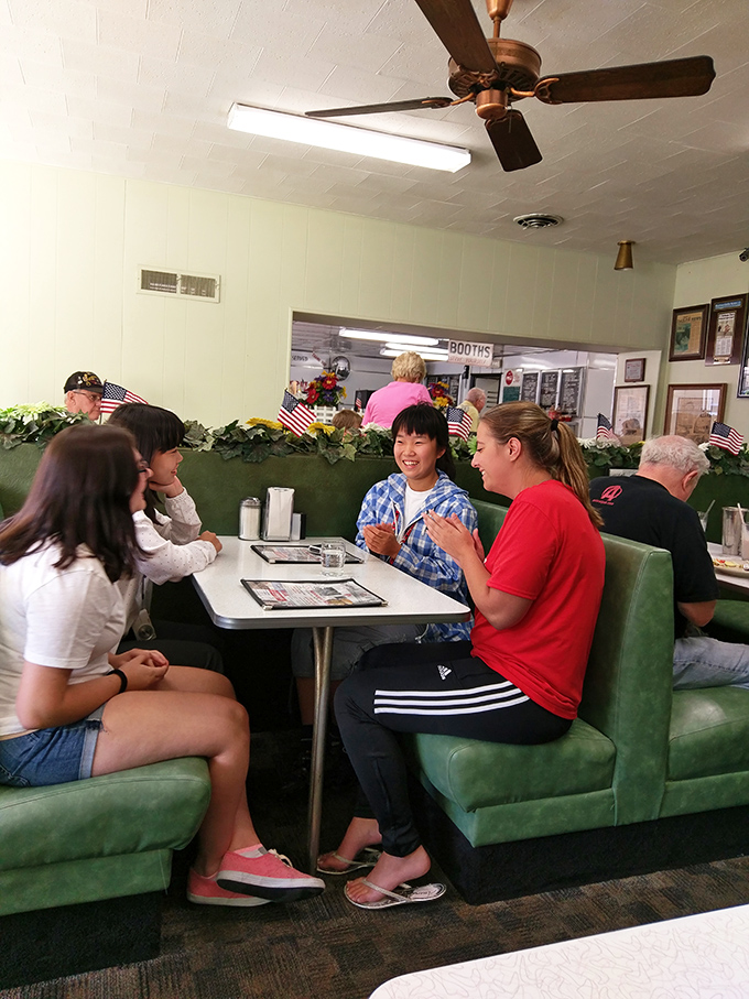 The true heart of K's&mdash;families and friends gathering in mint-green booths, creating memories between bites of classic American comfort food.