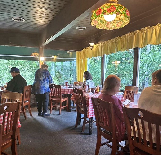 The sunroom dining area offers views of nature outside while you contemplate the nature of perfect fried chicken inside.