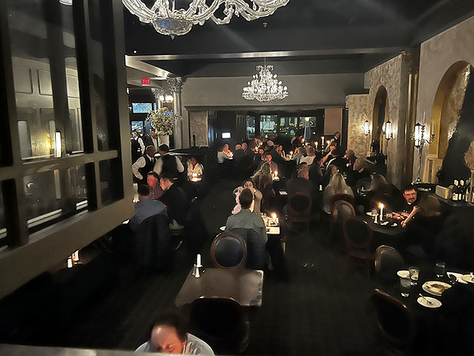 A full house of diners basking in chandelier glow. The collective joy of people who've just realized they've made an excellent dinner decision.