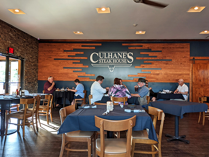 The signature blue and wood wall serves as both stylish backdrop and silent testimony to countless celebrations, first dates, and "just because" dinners.