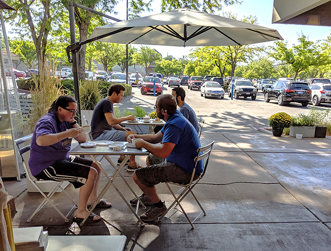 Outdoor dining that turns a parking lot view into a European-style caf&eacute; experience. Proof that good company and better pastries transform any space.