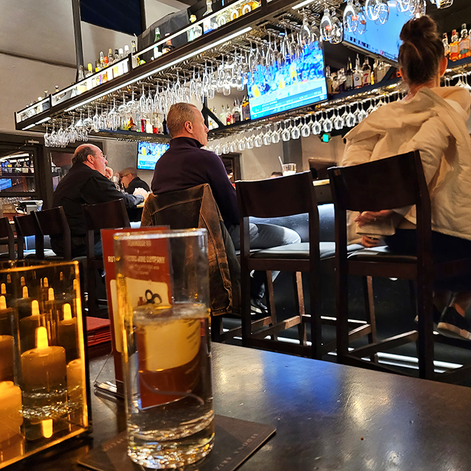 Happy diners at the bar prove that good food creates instant friendships and animated conversations everywhere.