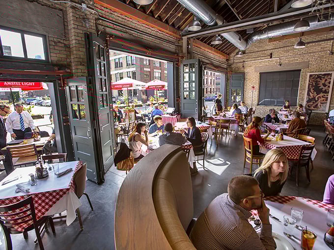 Sunlight streams through massive windows, illuminating happy diners who've discovered that great seafood doesn't require an ocean view.