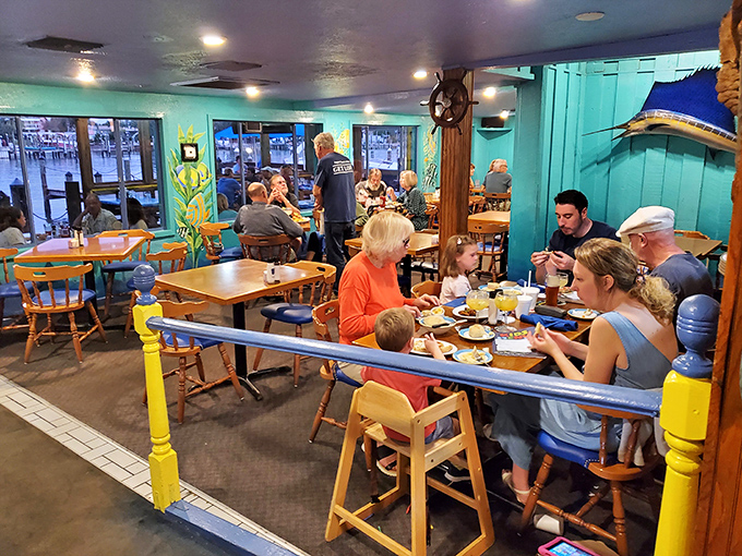 Families gathered around wooden tables, enjoying seafood treasures&mdash;this isn't just dining, it's the communal Florida experience we all crave.
