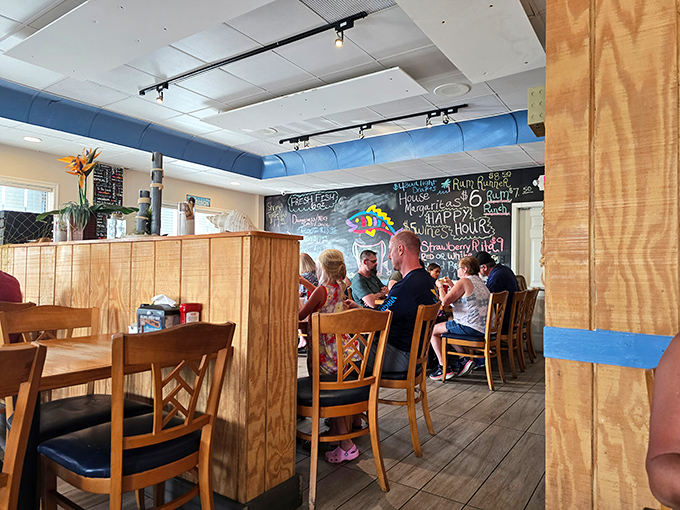 Cozy wooden booths and a chalkboard wall create that neighborhood joint feeling. The kind of place where "everybody knows your name"&mdash;or at least your favorite fish dish. 