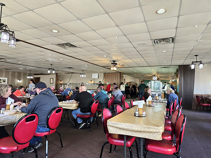 The dining room buzzes with conversation and the clinking of forks against plates. When food is this good, strangers become temporary family.