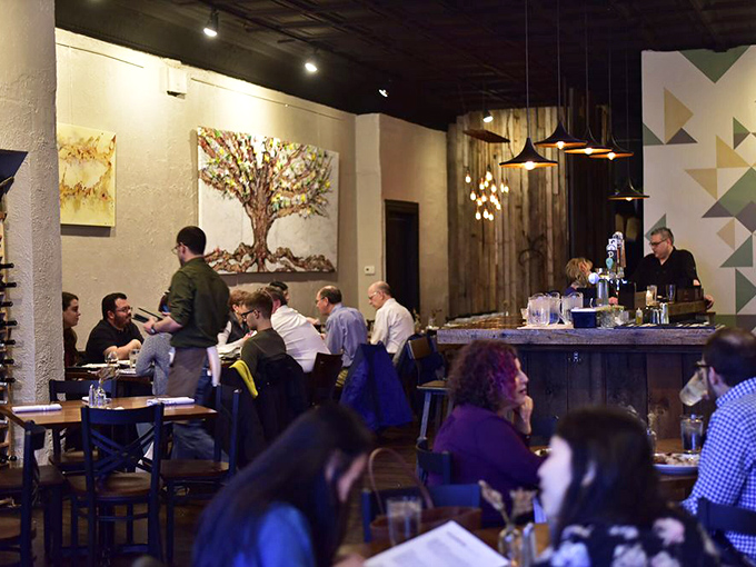 Where food lovers gather. That colorful tree artwork isn't the only thing blooming here&mdash;so are conversations and appetites.