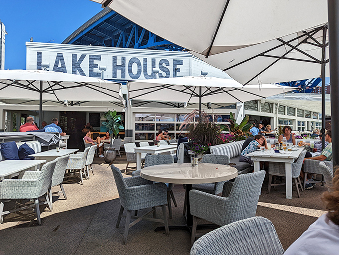 The outdoor patio at Lakehouse offers front-row seats to Cleveland's waterfront theater – sunshine, gentle breezes, and zero chance of bad views.