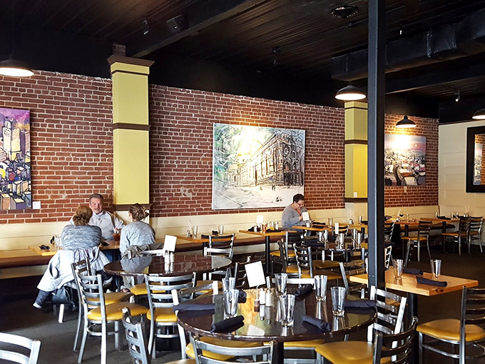 Exposed brick walls and thoughtful lighting create the perfect setting for conversations that flow as easily as the wine.