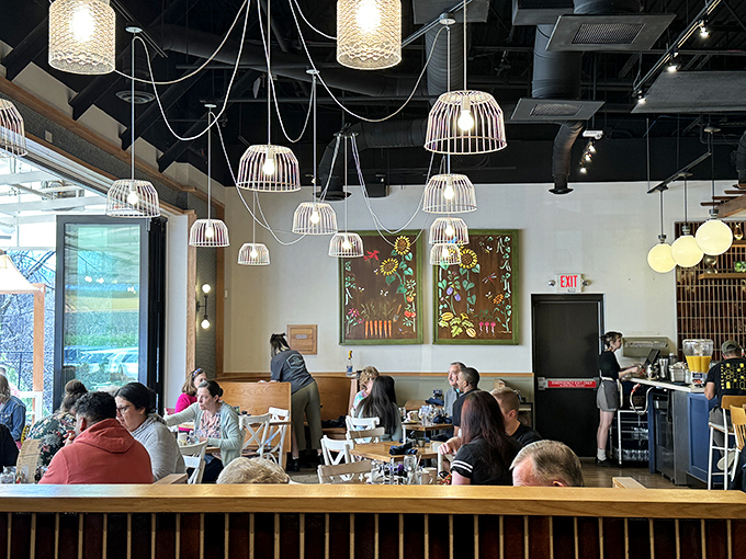 Modern Southern hospitality in action&mdash;where exposed ductwork meets warm conversation and nobody leaves hungry or unsmiling.